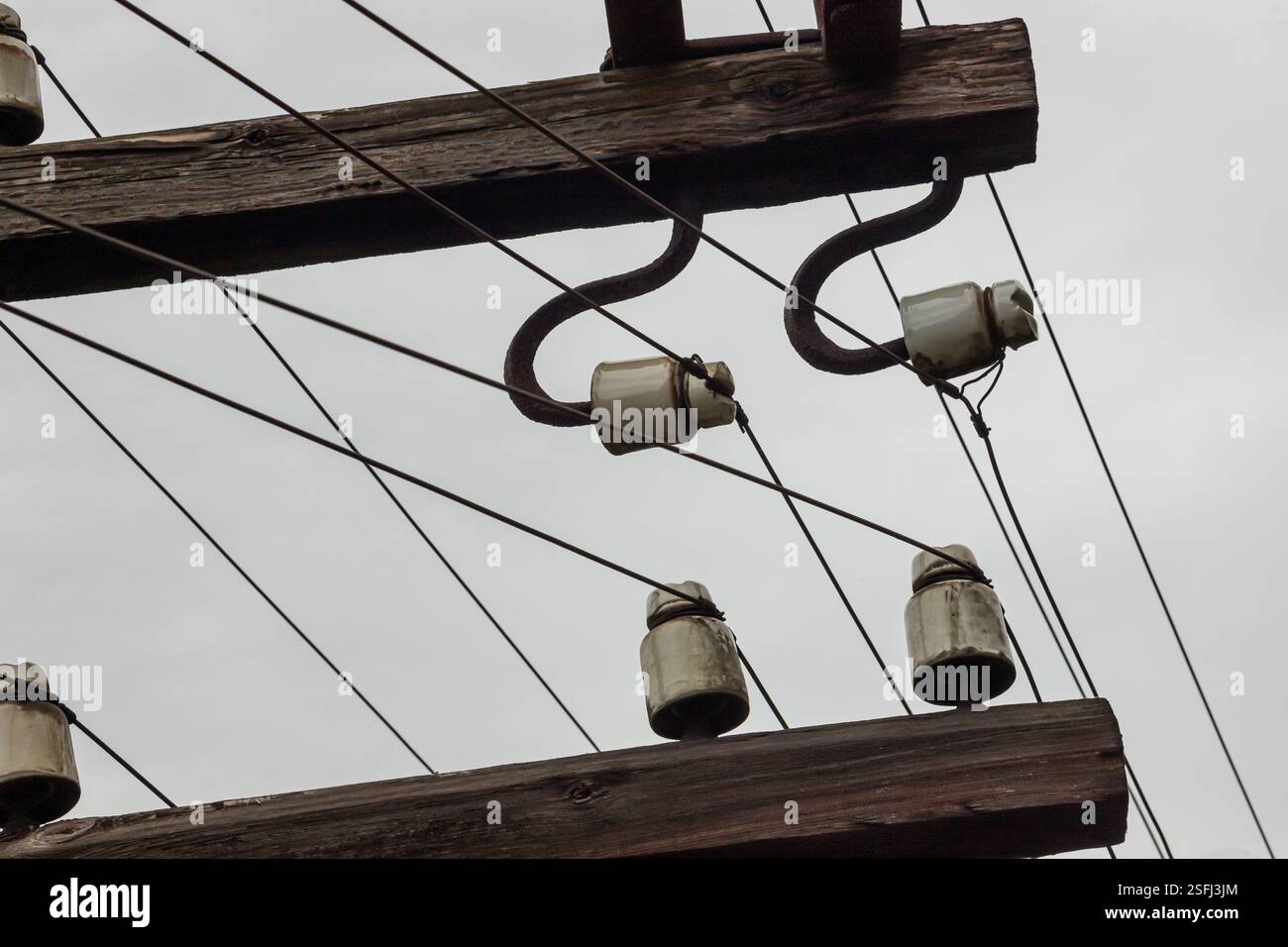Overhead power lines support ceramic insulators, connecting utility ...
