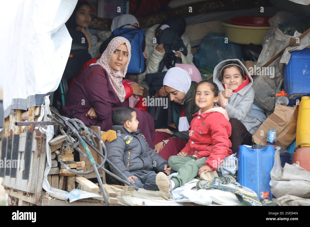 Displaced Palestinians cross the Netzarim corridor as they make their ...