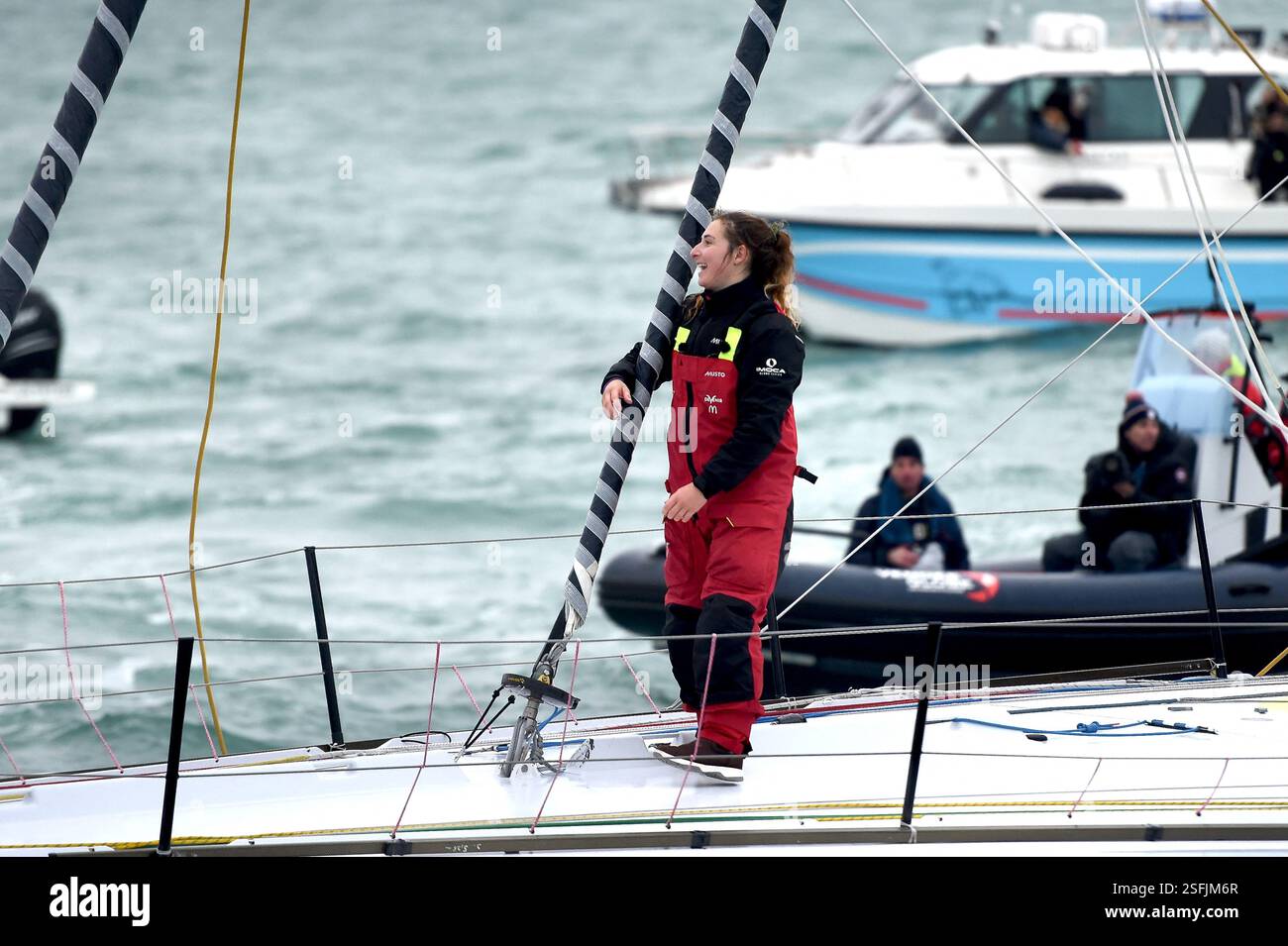 French skipper Violette Dorange celebrates on her Imoca monohull ...