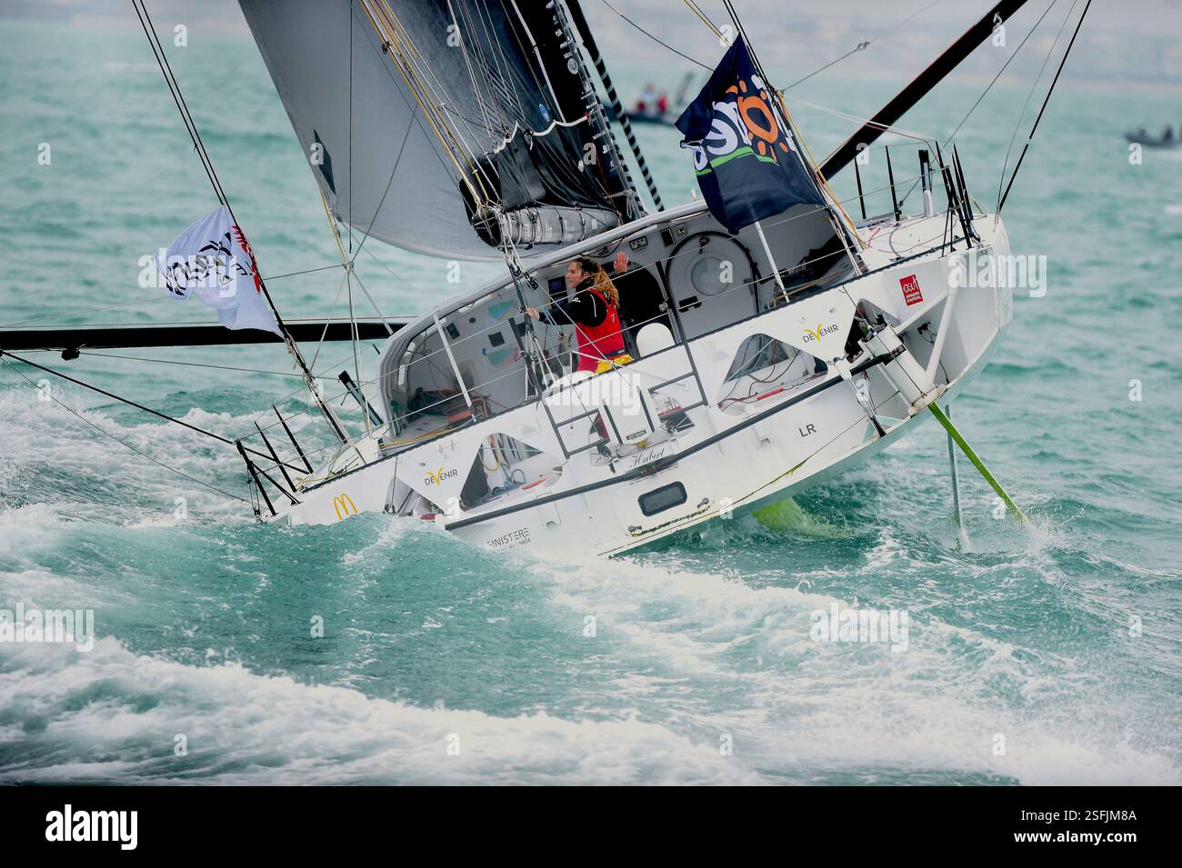French skipper Violette Dorange celebrates on her Imoca monohull ...