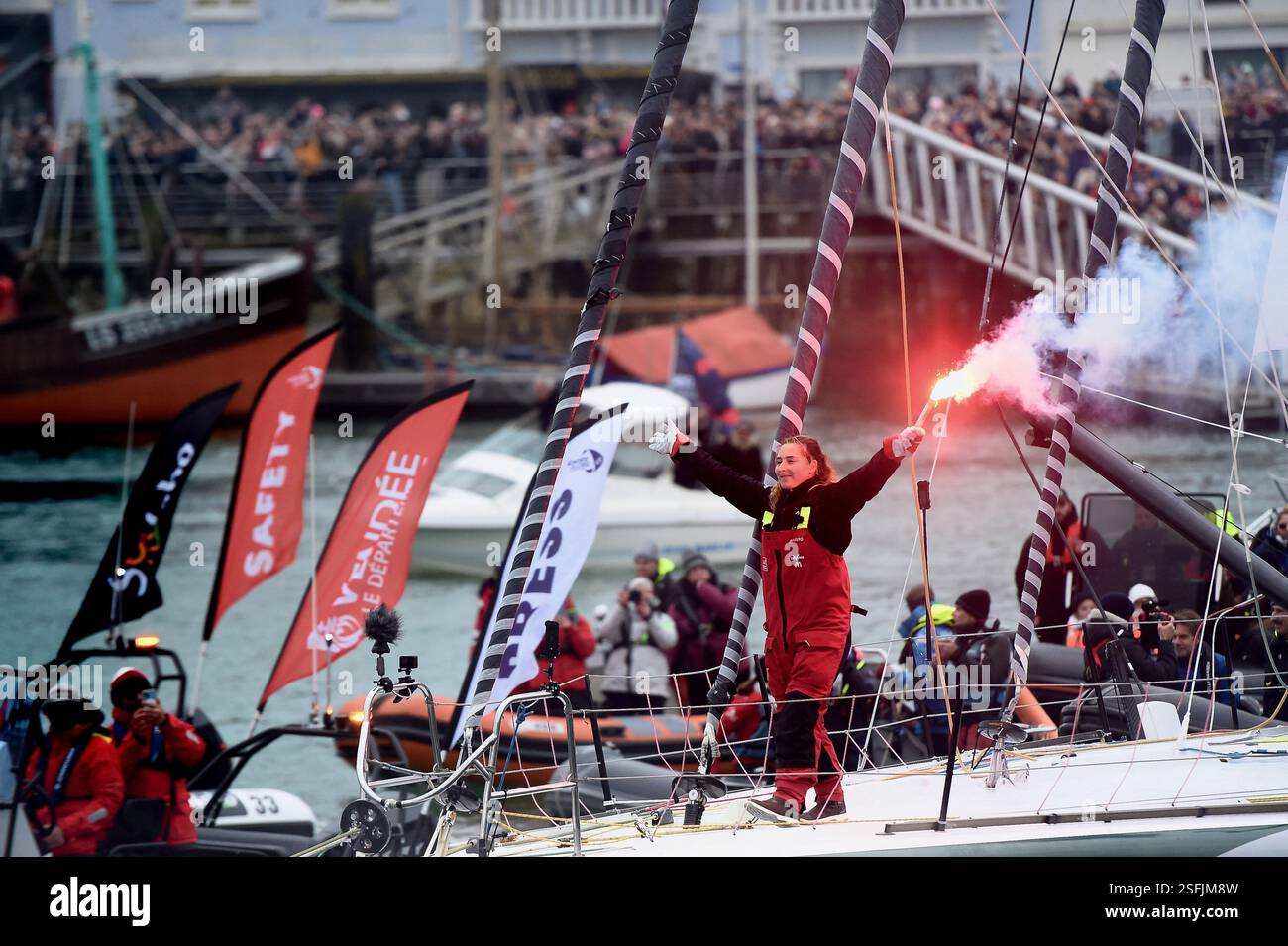 French skipper Violette Dorange celebrates on her Imoca monohull ...