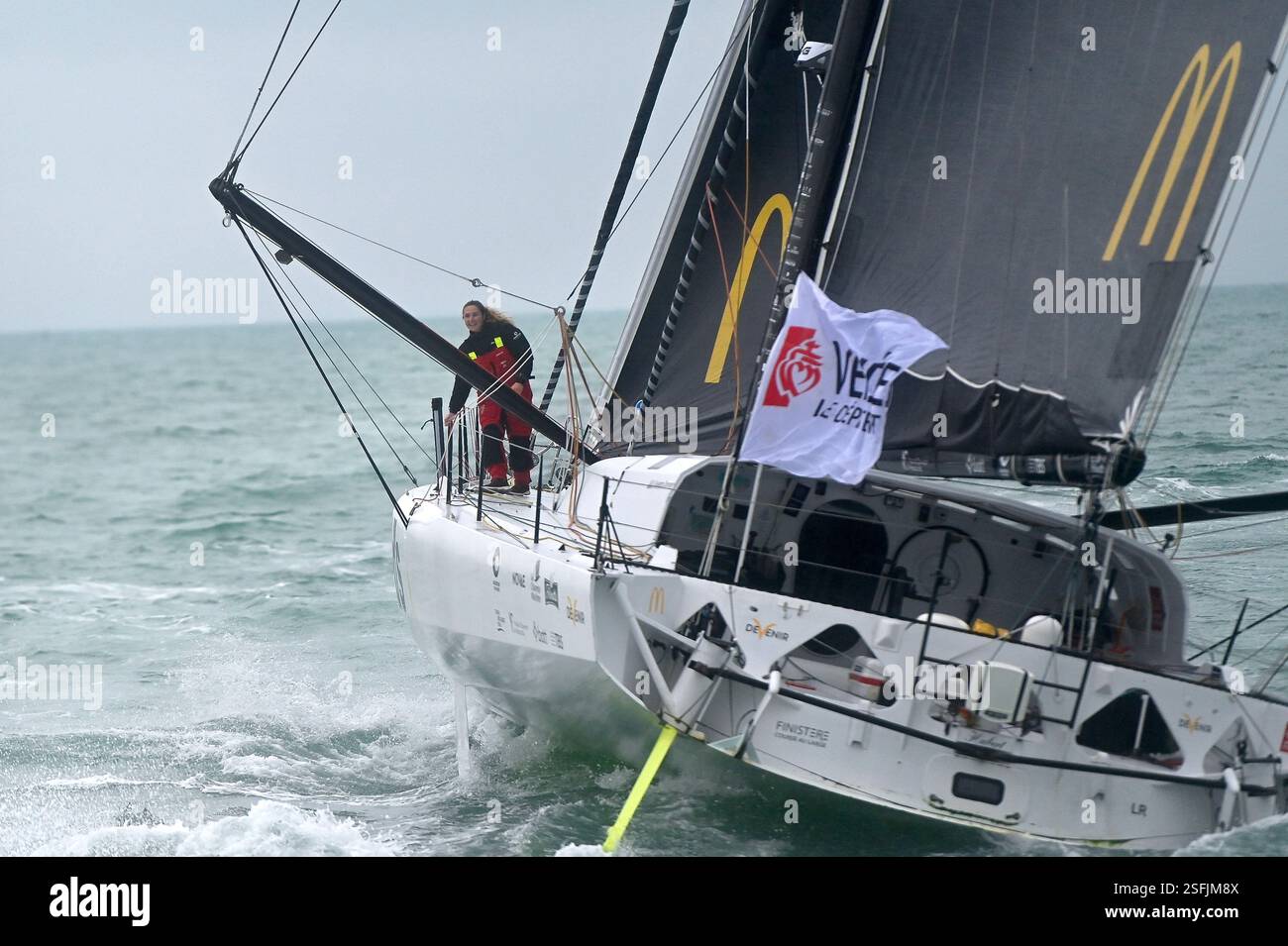 French skipper Violette Dorange celebrates on her Imoca monohull ...
