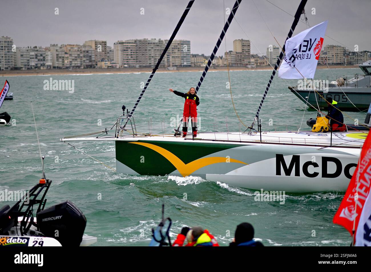French skipper Violette Dorange celebrates on her Imoca monohull ...