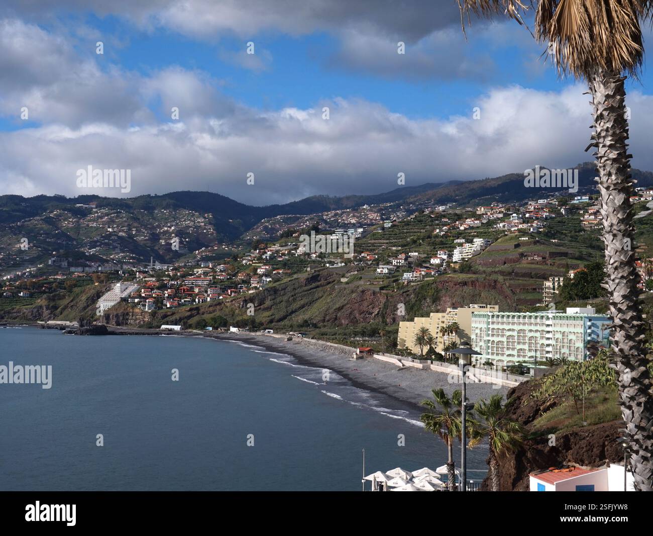 The promenade footpath to a black pebble beach, Praia Formosa, around ...