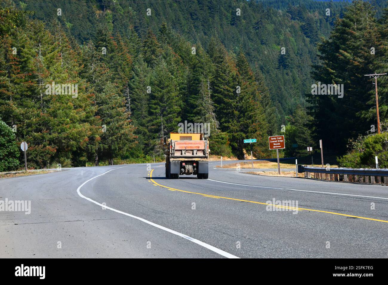 Heavy truck has sign on back stating construction vehicle do not follow ...
