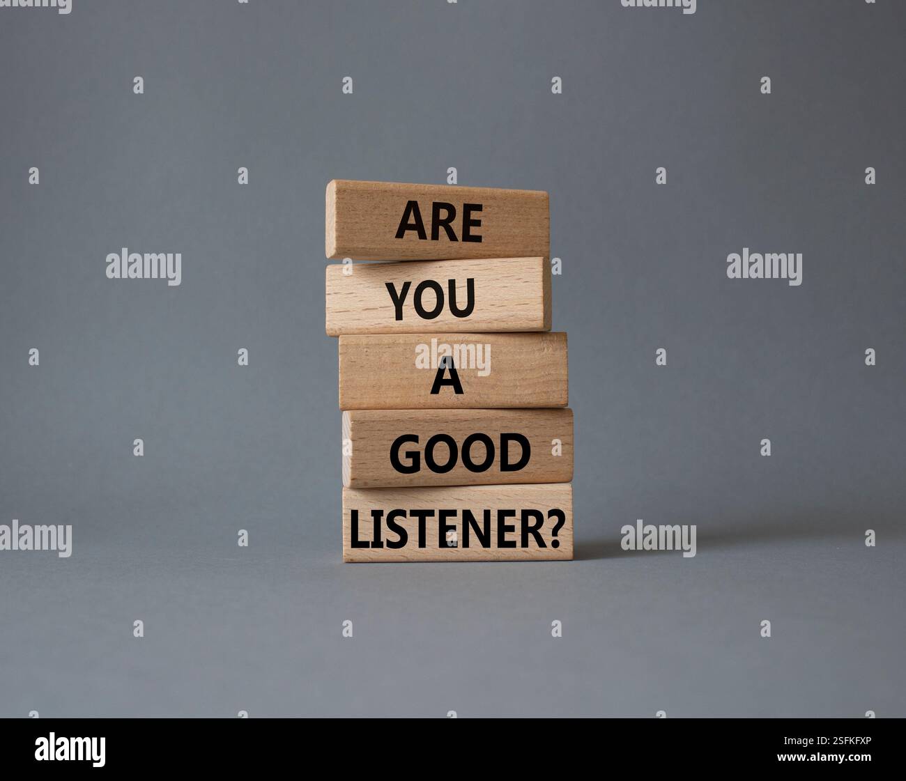 Listening skills symbol. Wooden blocks with words Are you a good ...