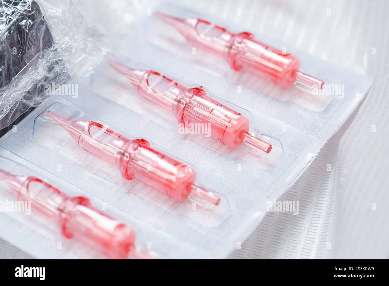 Closeup of medical syringes filled with bright red liquid, safely ...