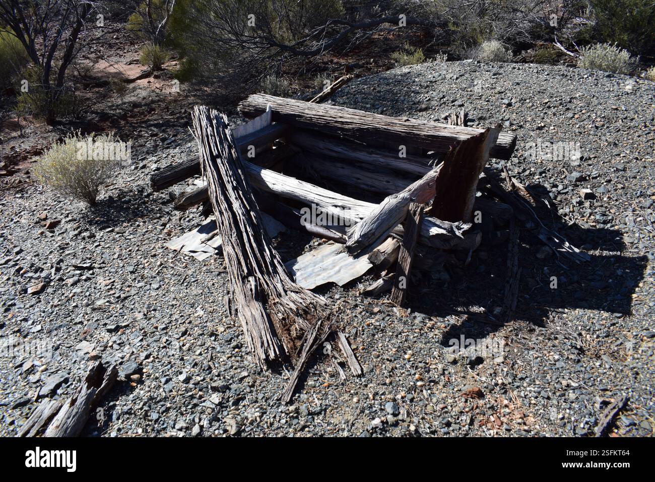 A forgotten wooden gold mine entrance in the vast desert near ...