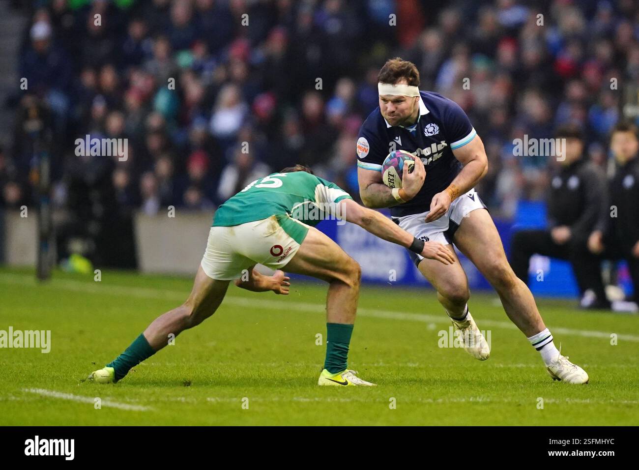Scotland's Ewan Ashman is tackled by Ireland's Hugo Keenan (left ...