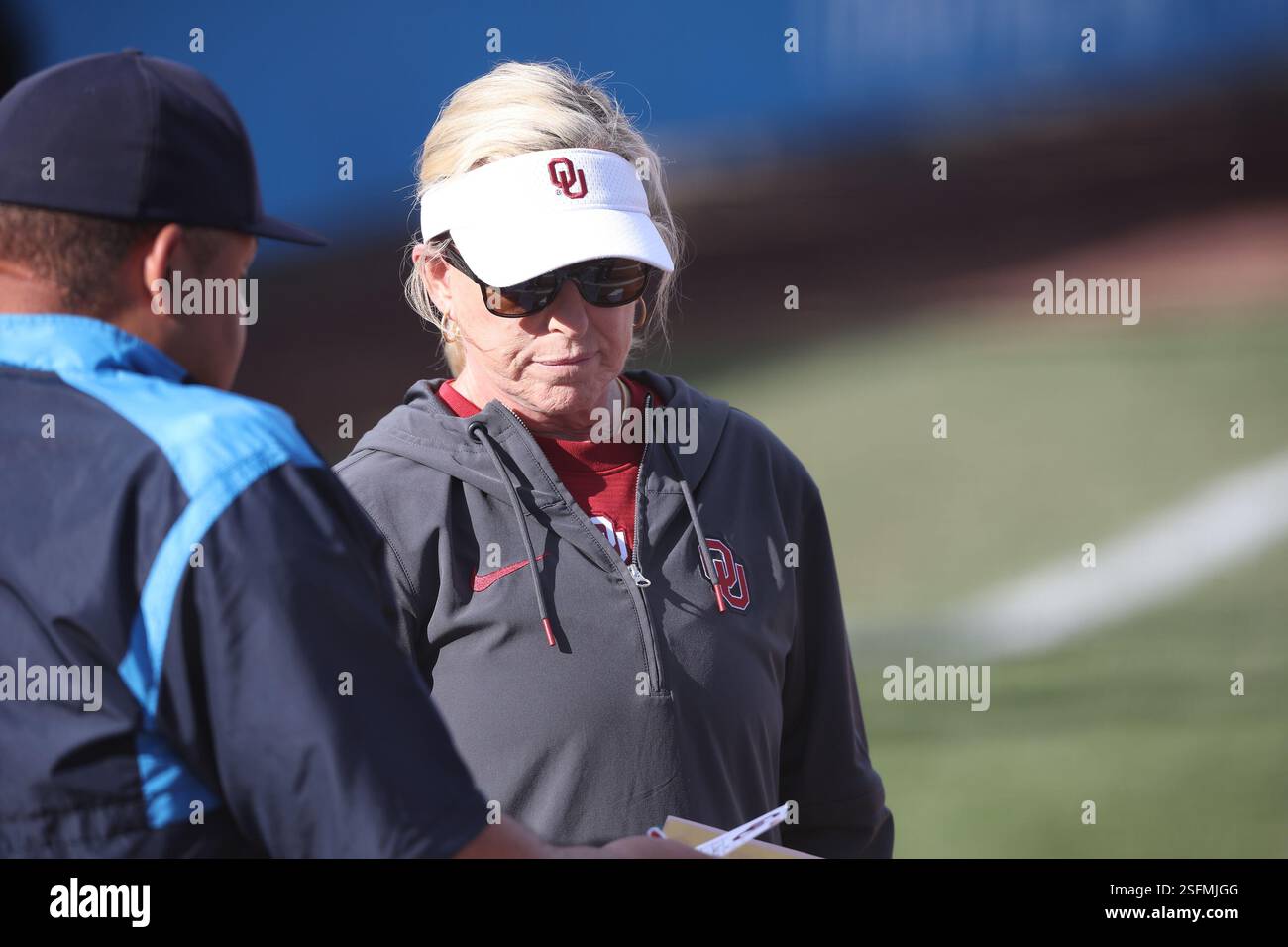 February 8, 2025: Oklahoma Head Coach Patty Gasso meets with home plate ...