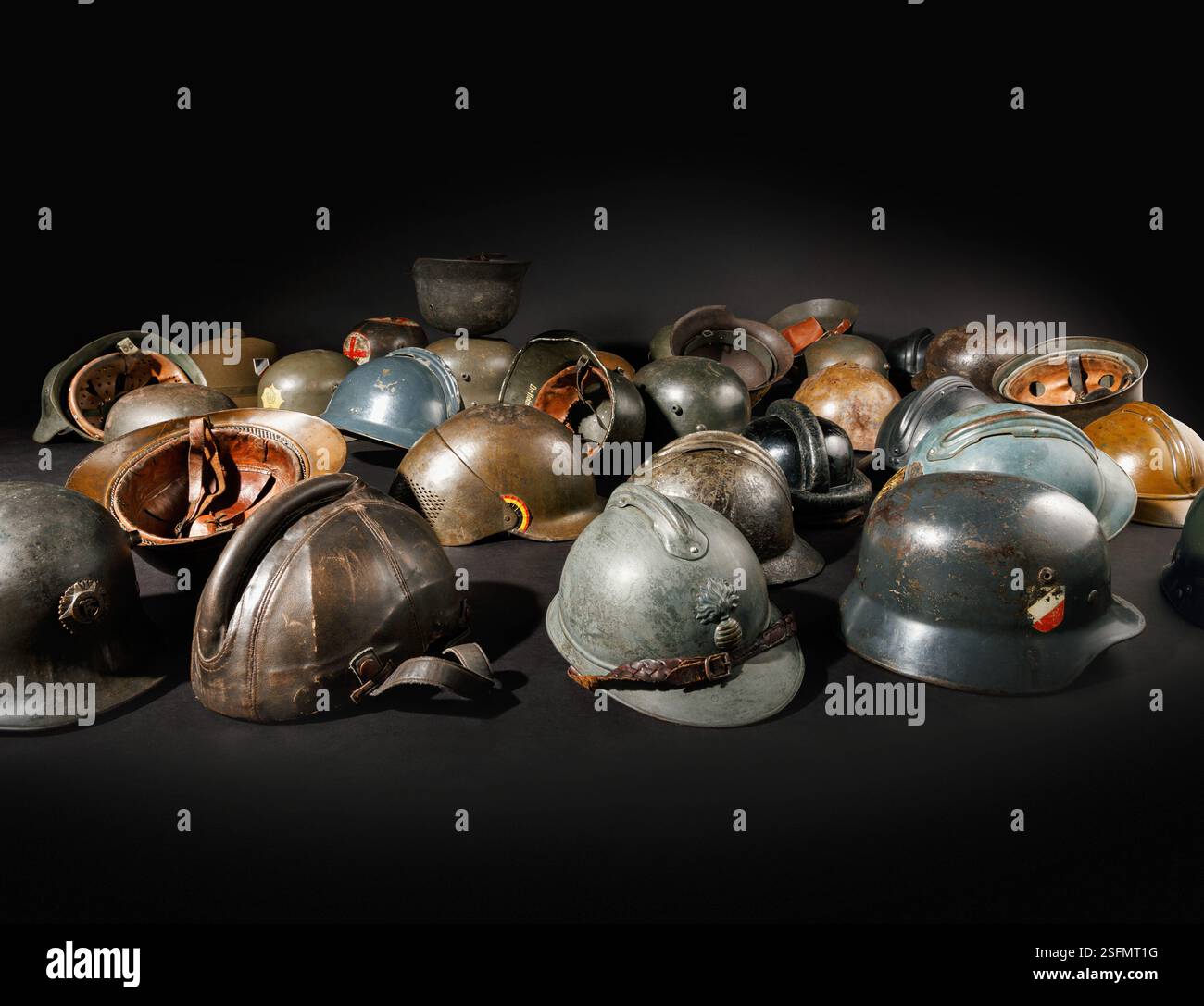 Collection of historical military helmets from different eras as relics ...
