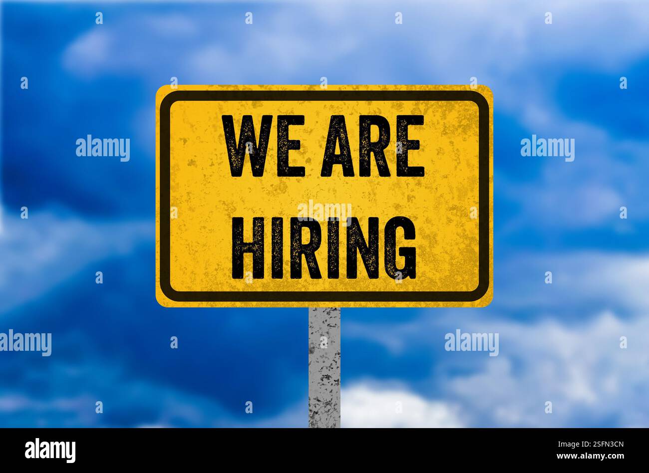 We are hiring message written on yellow metal sign. Conceptual we are ...