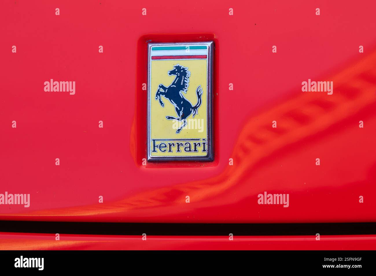 Badge on the bonnet, hood of a red Rosso Corsa Ferrari Spider F355 ...