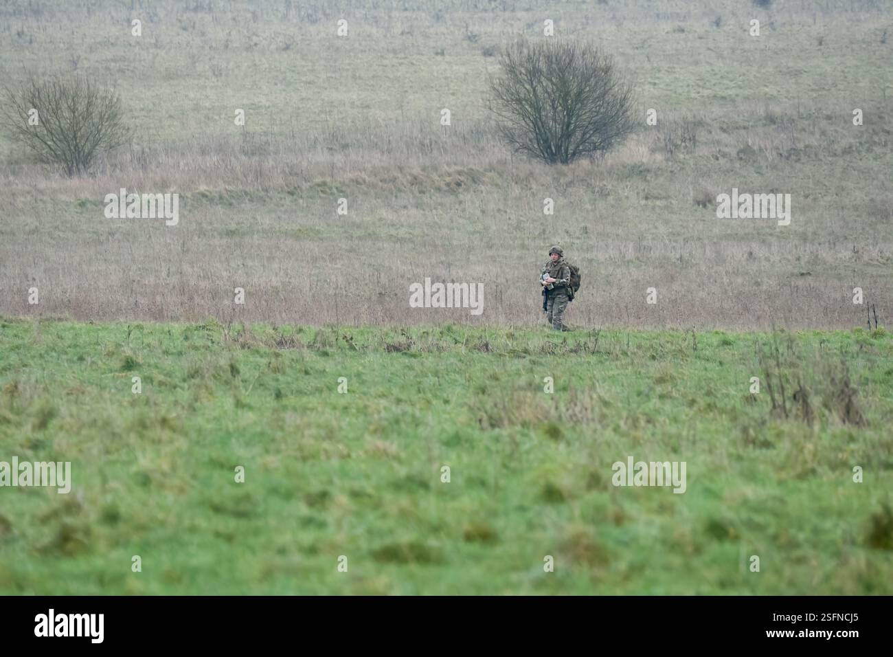 a British army infantry soldier on a tabbing exercise bearing full 40Kg ...