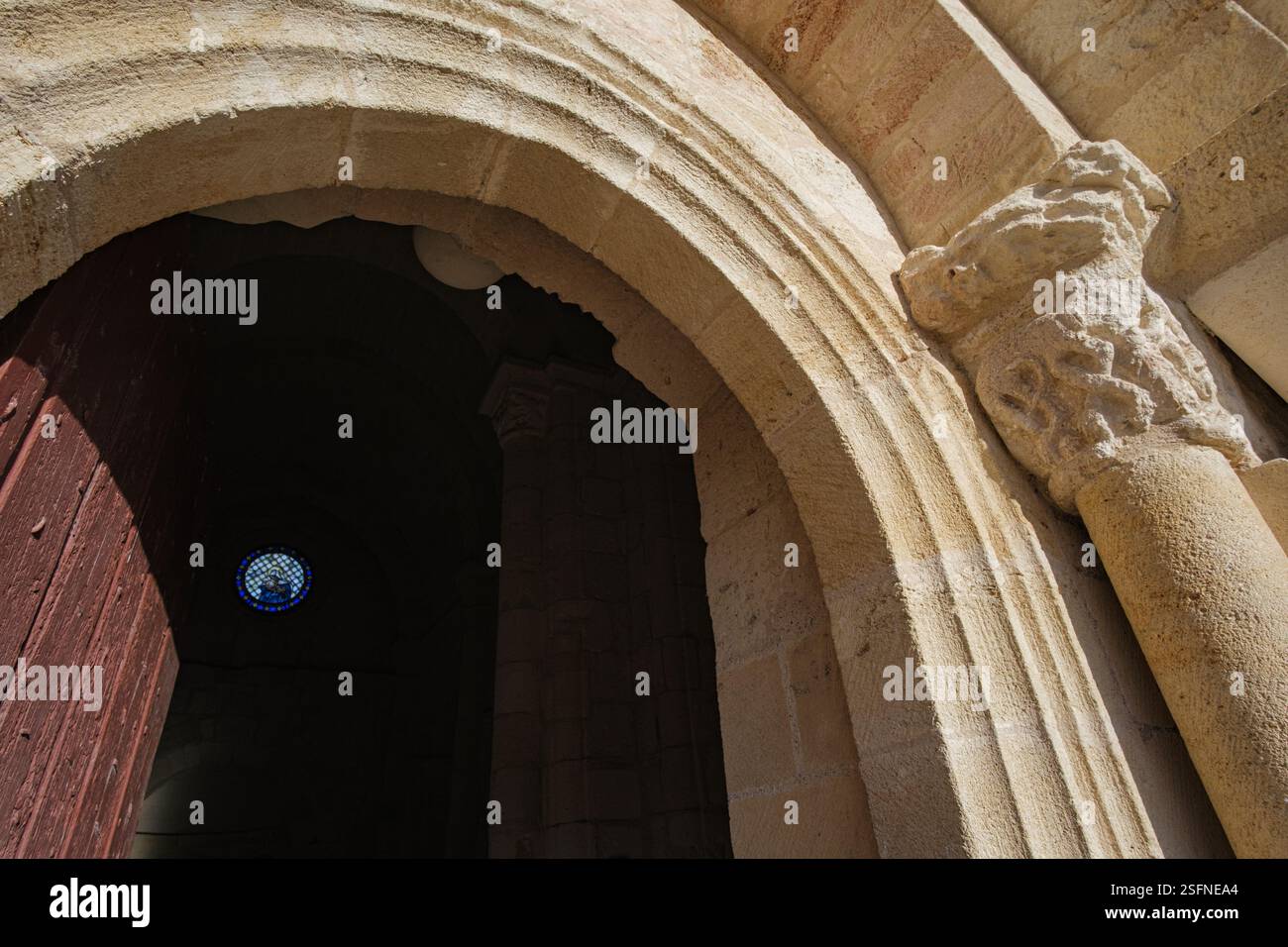 horizontal wide angle view of romanesque church entrance, carved ...