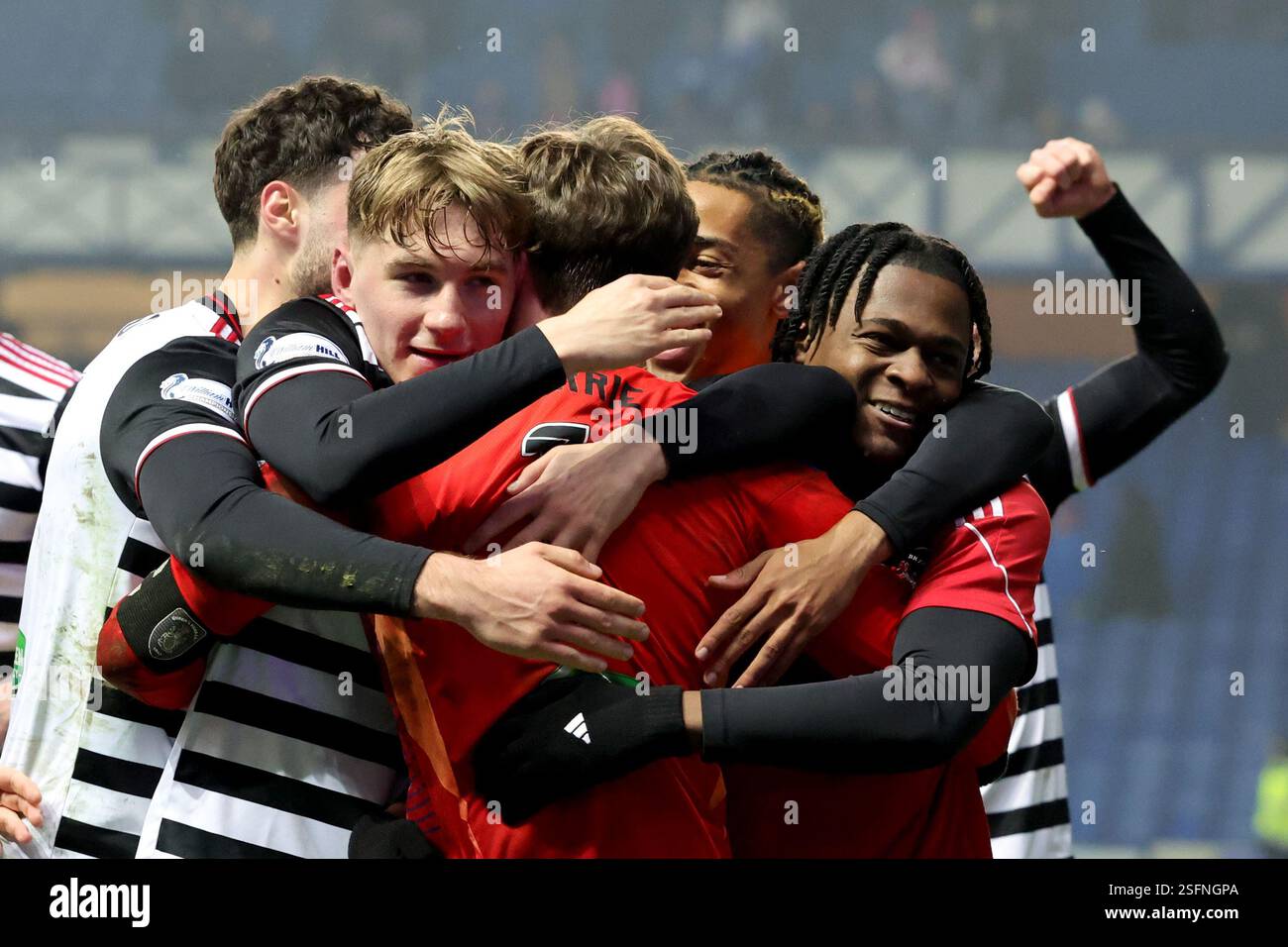 Queen’s Park goalkeeper Calum Ferrie is congratulated by his teammates ...
