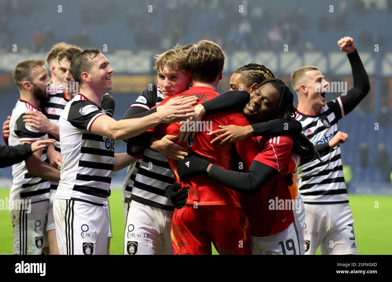 Queen’s Park goalkeeper Calum Ferrie is congratulated by his teammates ...
