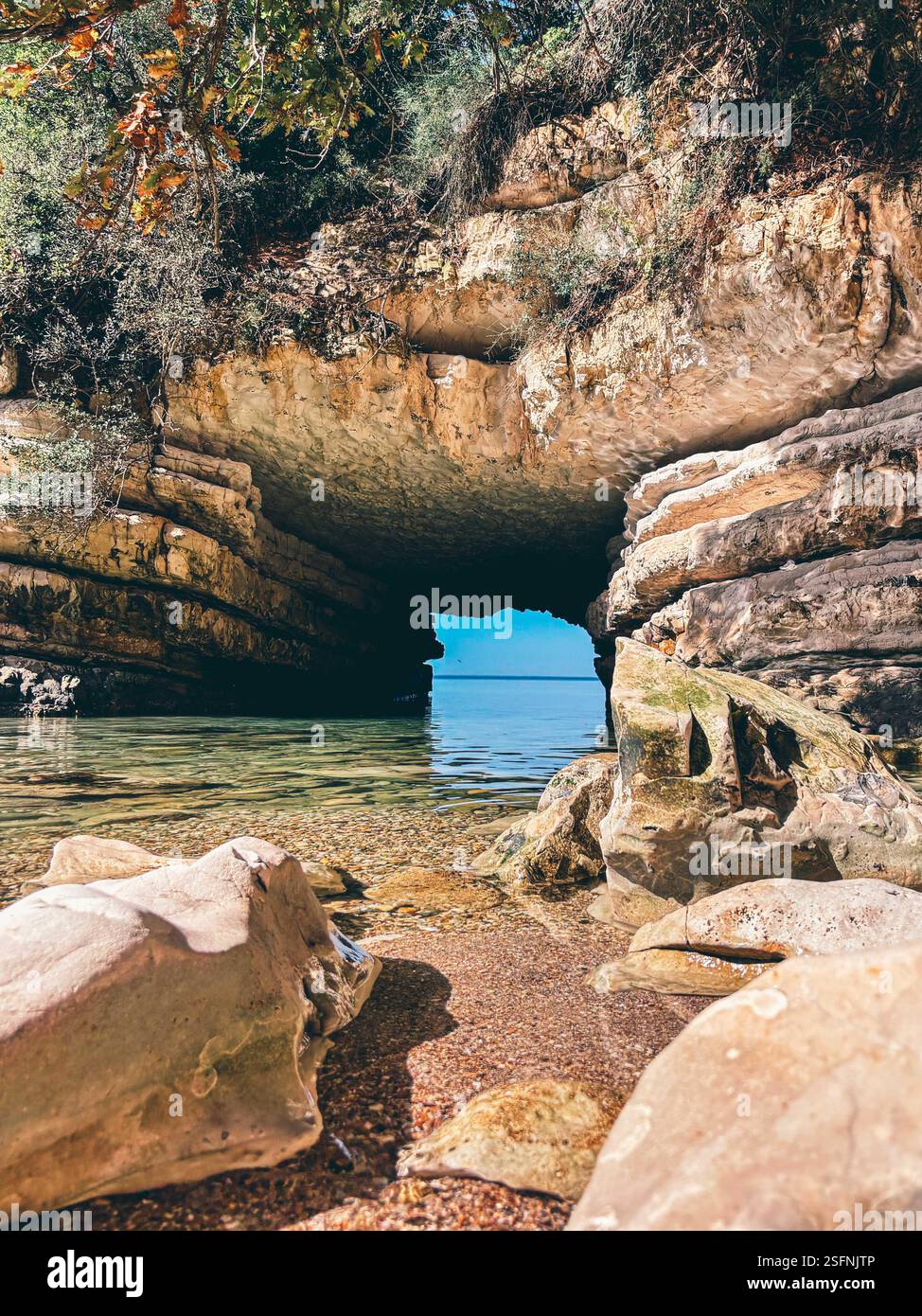 Sandstone rocks and pebble cove beach of Delikli Bay beach near Kerpe ...