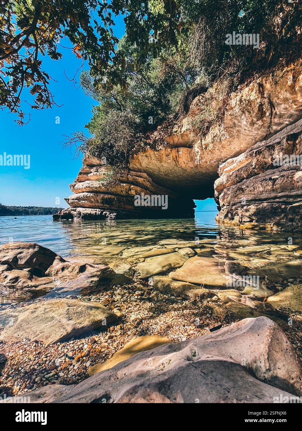 Sandstone rocks and pebble cove beach of Delikli Bay beach near Kerpe ...