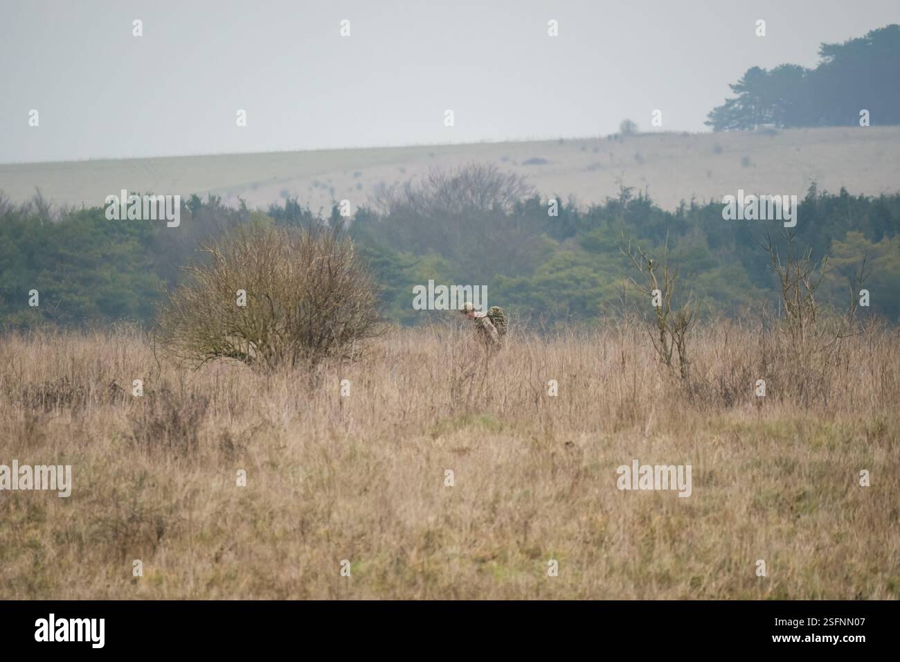 a British army infantry soldier on a tabbing exercise bearing full 40Kg ...
