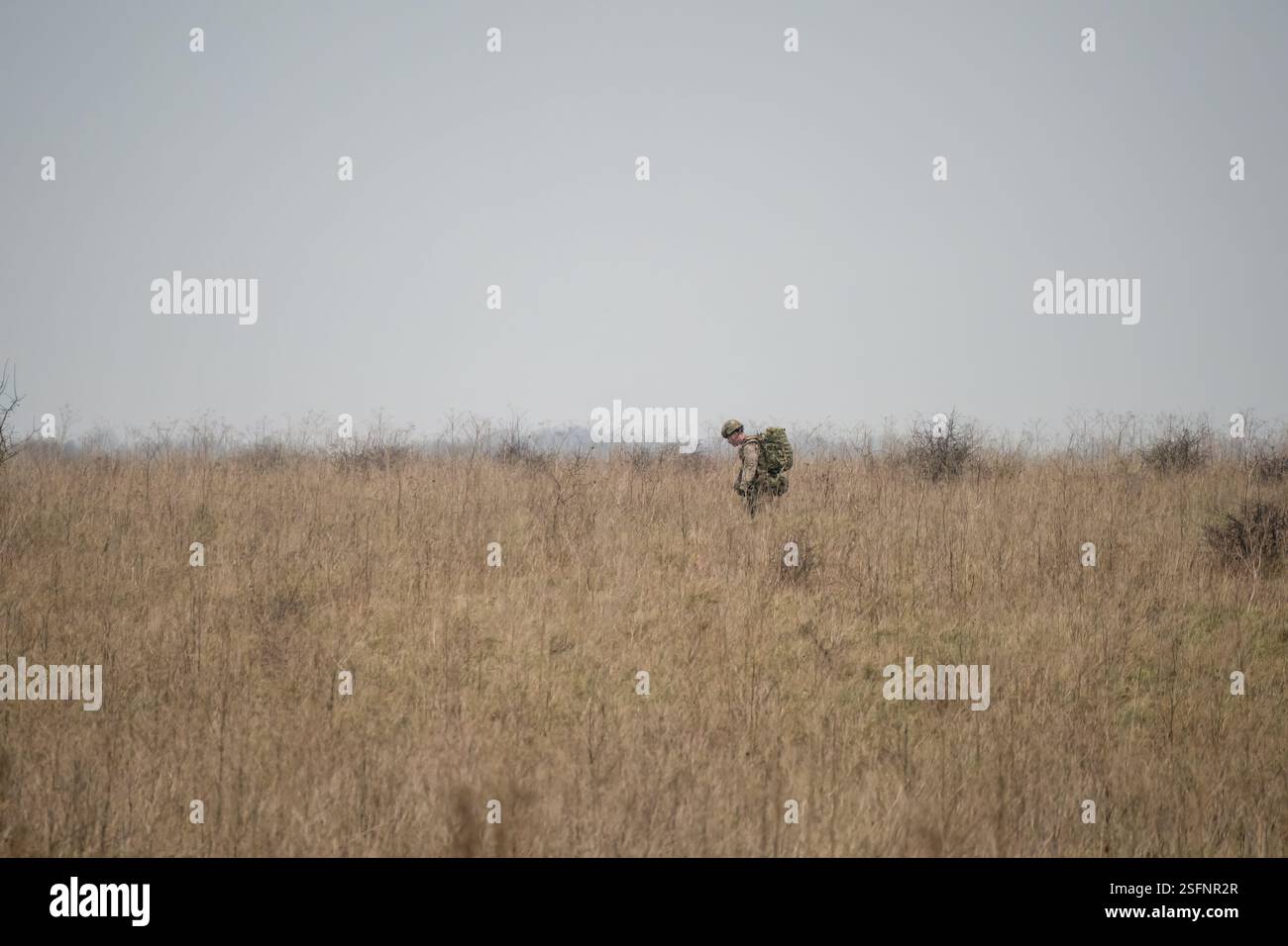 a British army infantry soldier on a tabbing exercise bearing full 40Kg ...