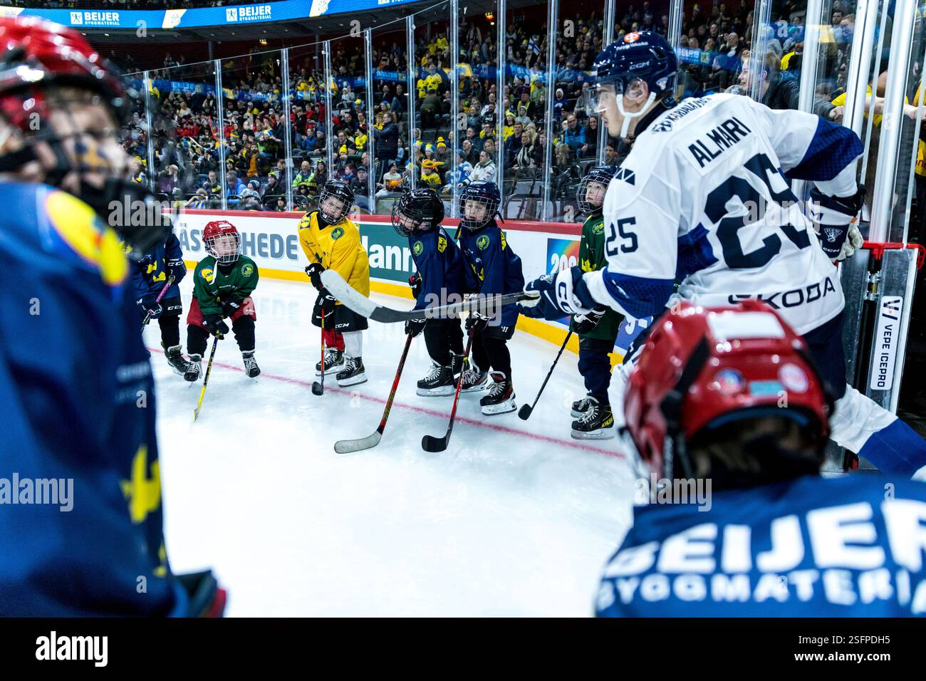250209 Mascots and Niclas Almari of Finland on ice ahead of second ...