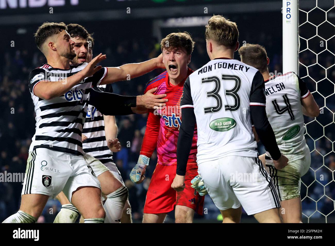 Queen’s Park goalkeeper Calum Ferrie is congratulated by his teammates ...