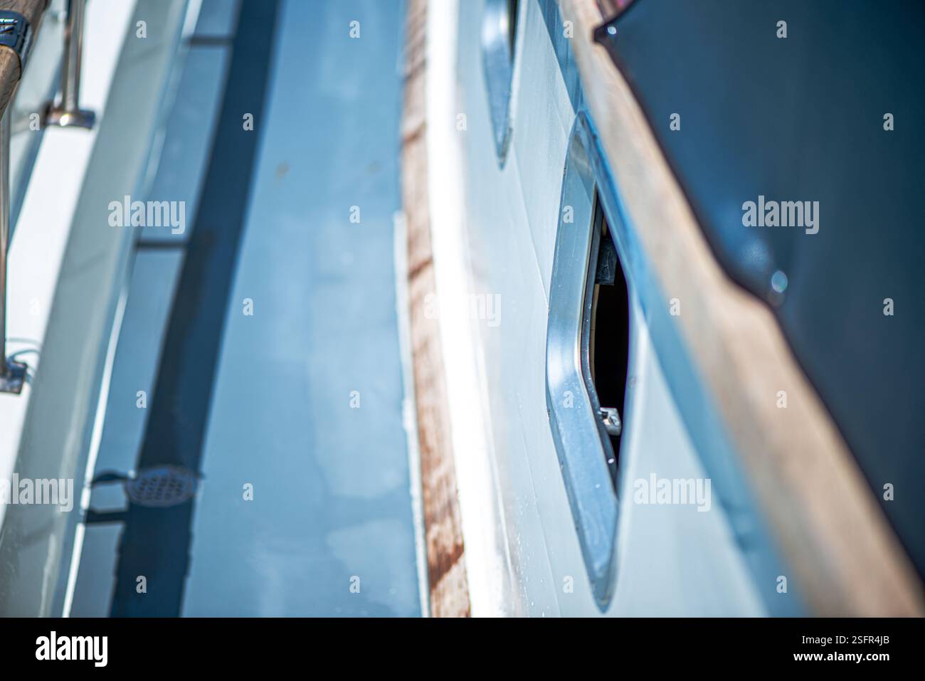 A serene view through a ship cabin window, capturing the vast ocean and ...