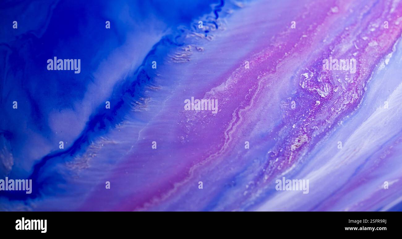 Marble flow. Sparkling ink. Defocused pink blue purple color shiny dust ...