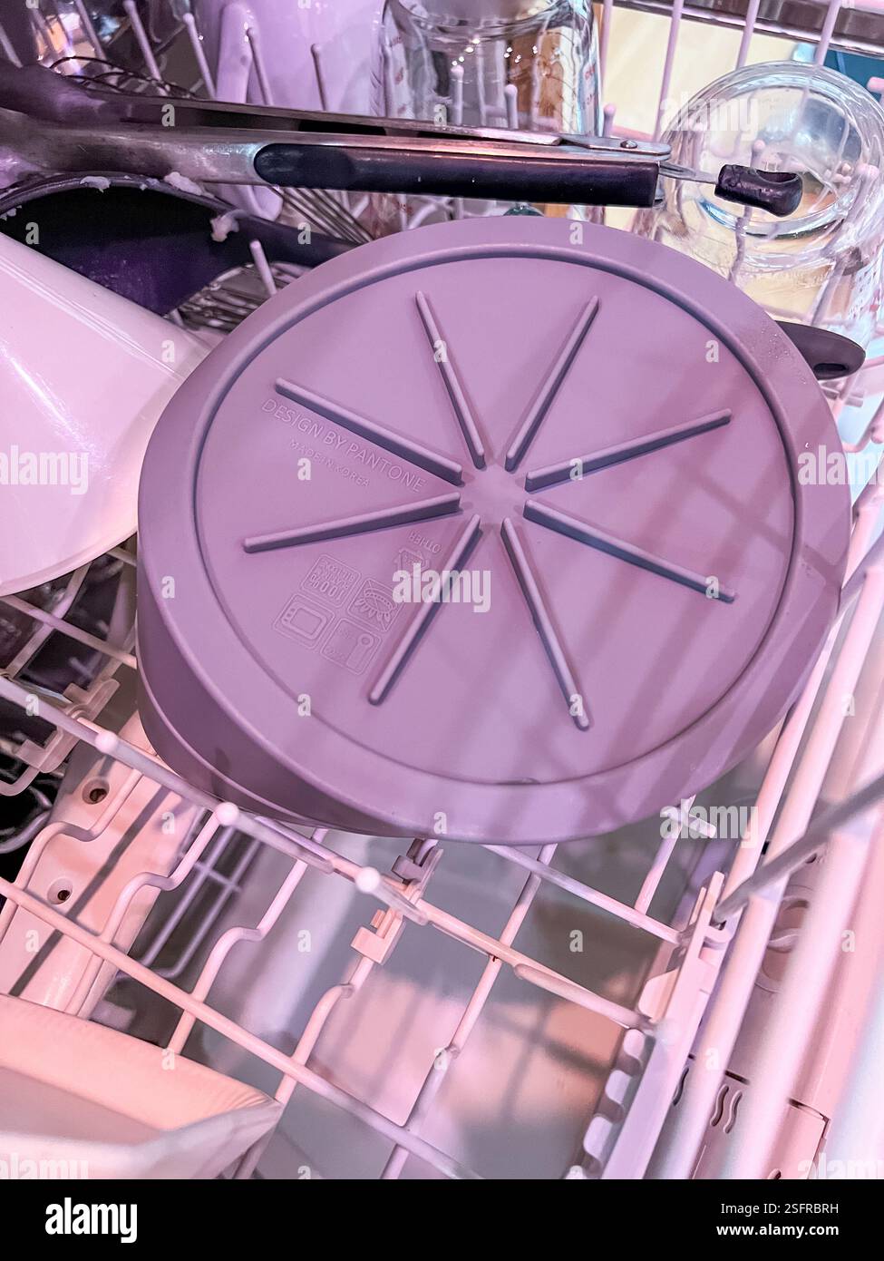 Silicone lid inside dishwasher during wash cycle Stock Photo - Alamy