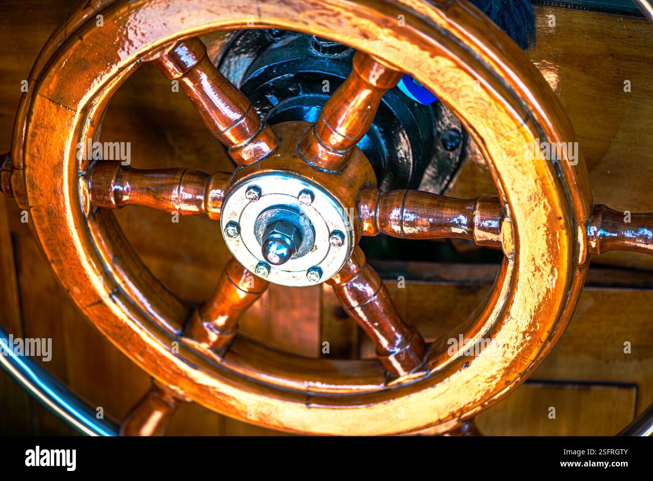 A highly detailed macro shot of a classic wooden ship wheel ...