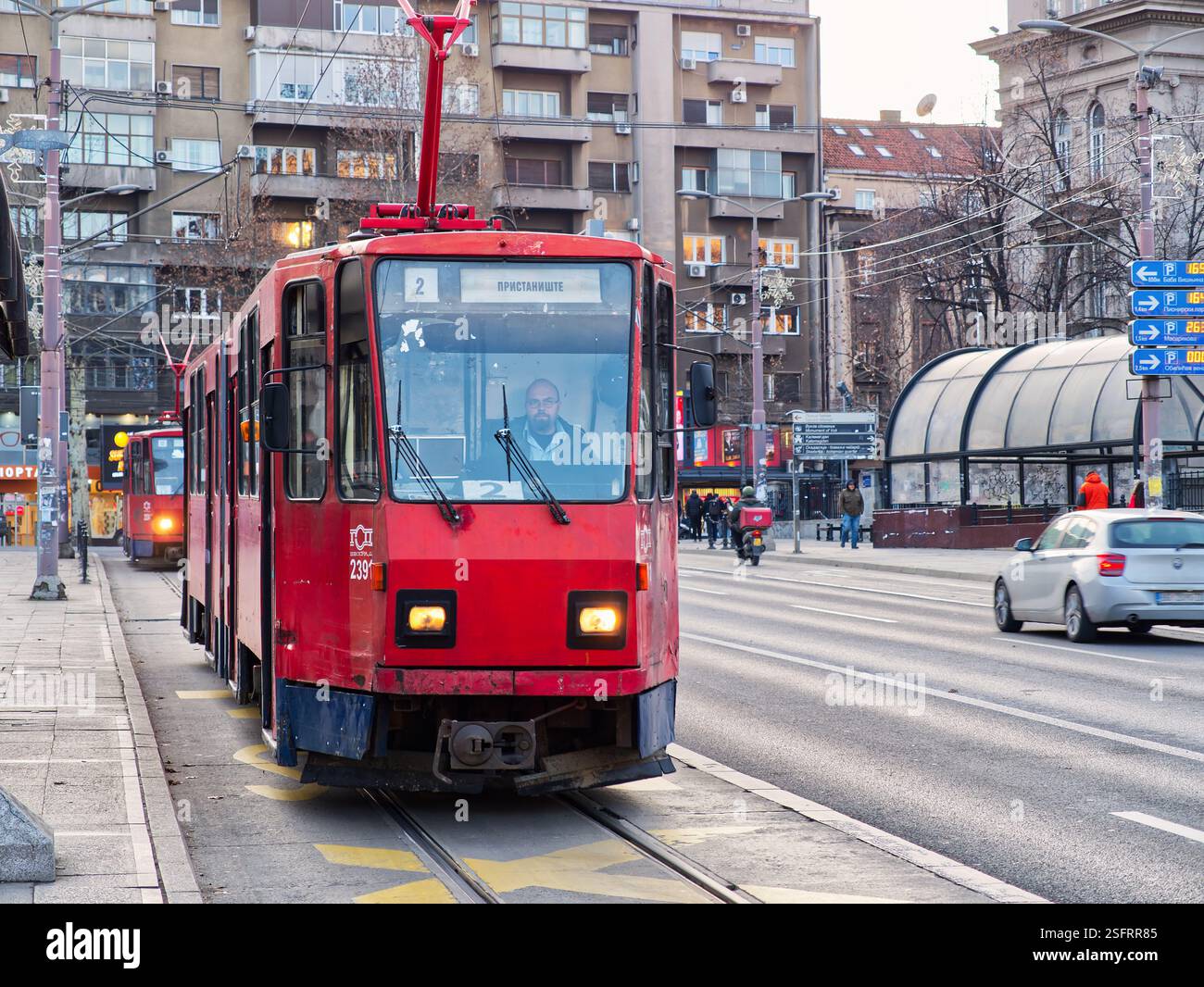 Belgrade, Serbia - January 11, 2025: A bright red tram operates on a ...