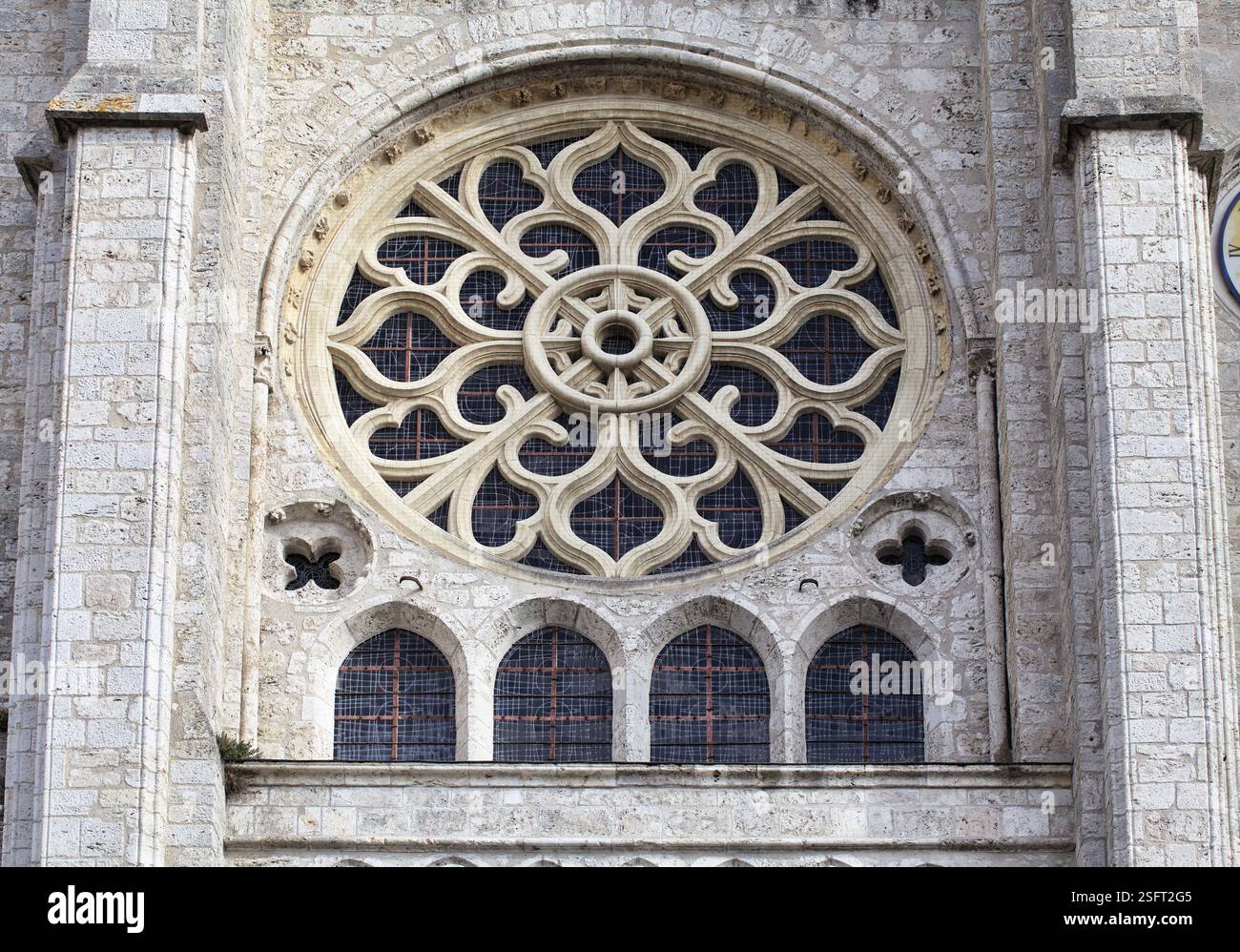 Rose window and elegant stone carvings of gothic church of Saint ...