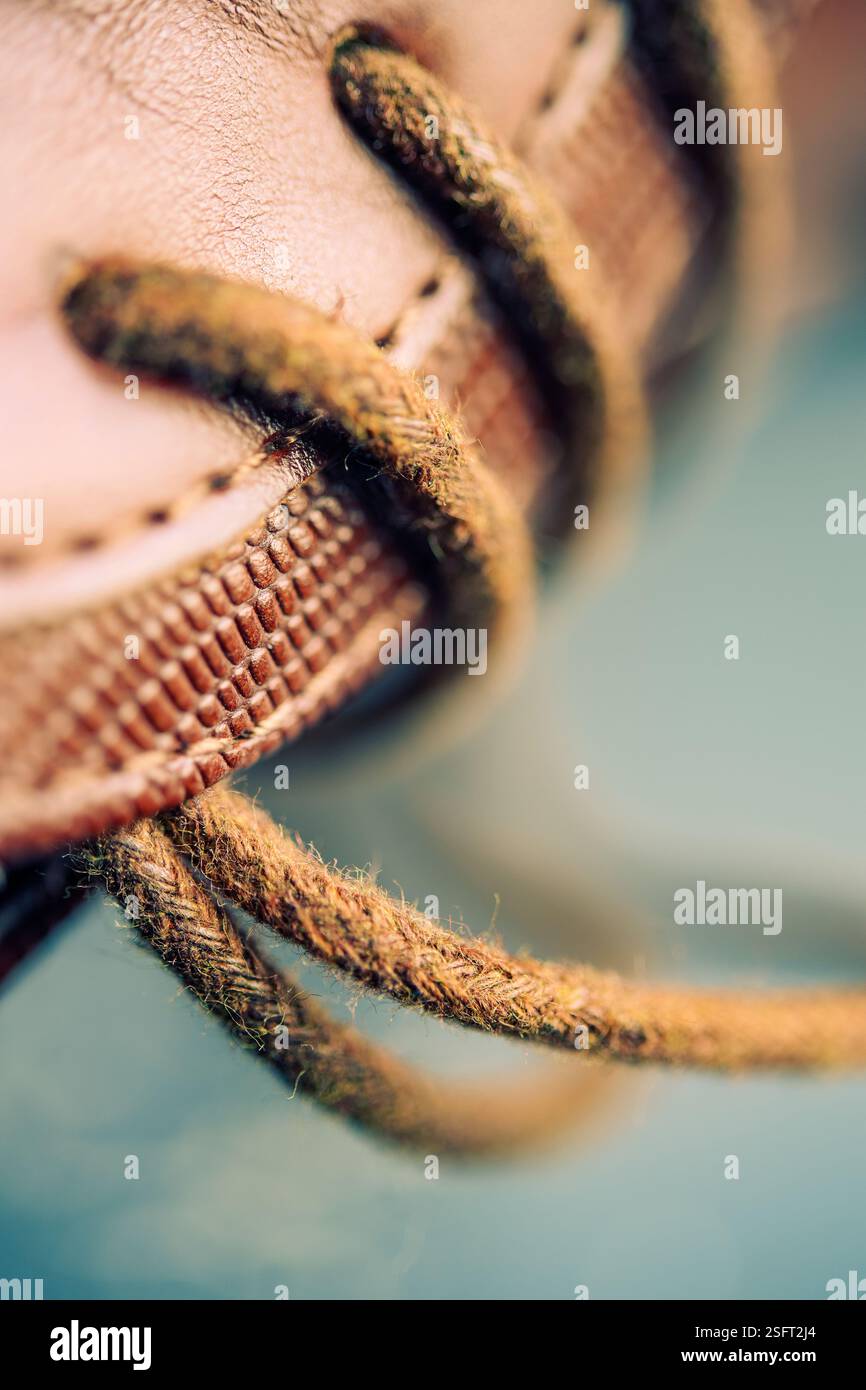 Close-up of an untied shoelace on a brown shoe Stock Photo - Alamy