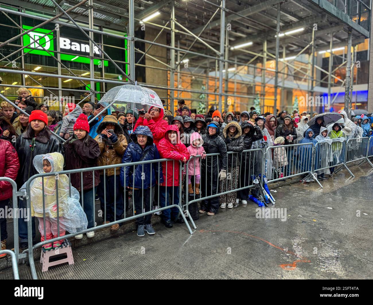 New York, New York, November 28, 2024: A crowd of people watch the ...