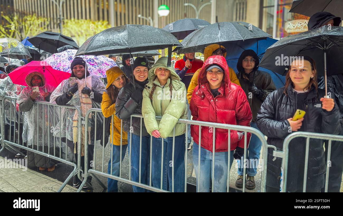 New York, New York, November 28, 2024: A crowd of people watch the ...