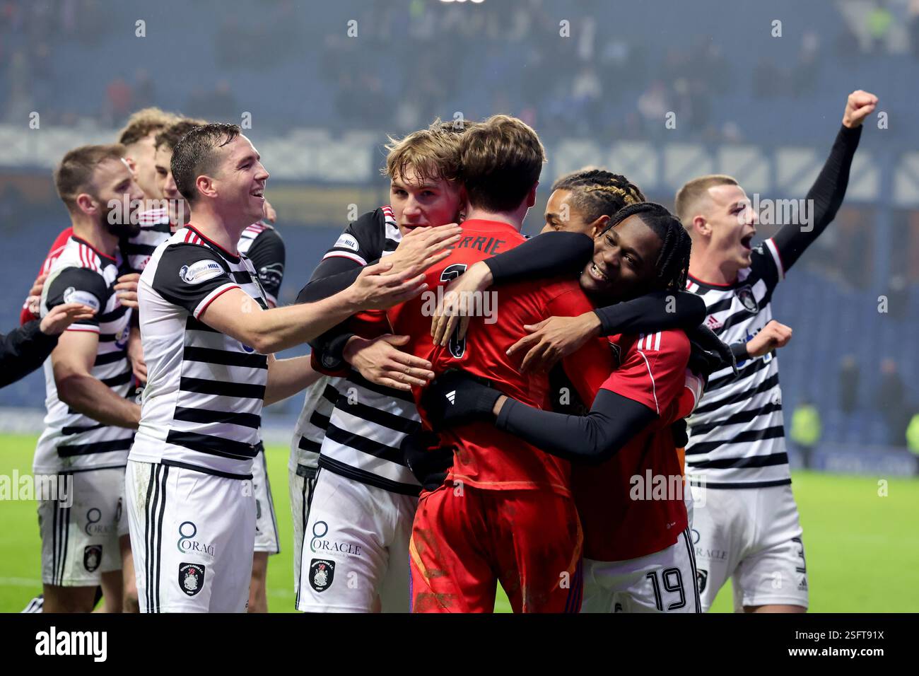 Queen’s Park goalkeeper Calum Ferrie is congratulated by his teammates ...