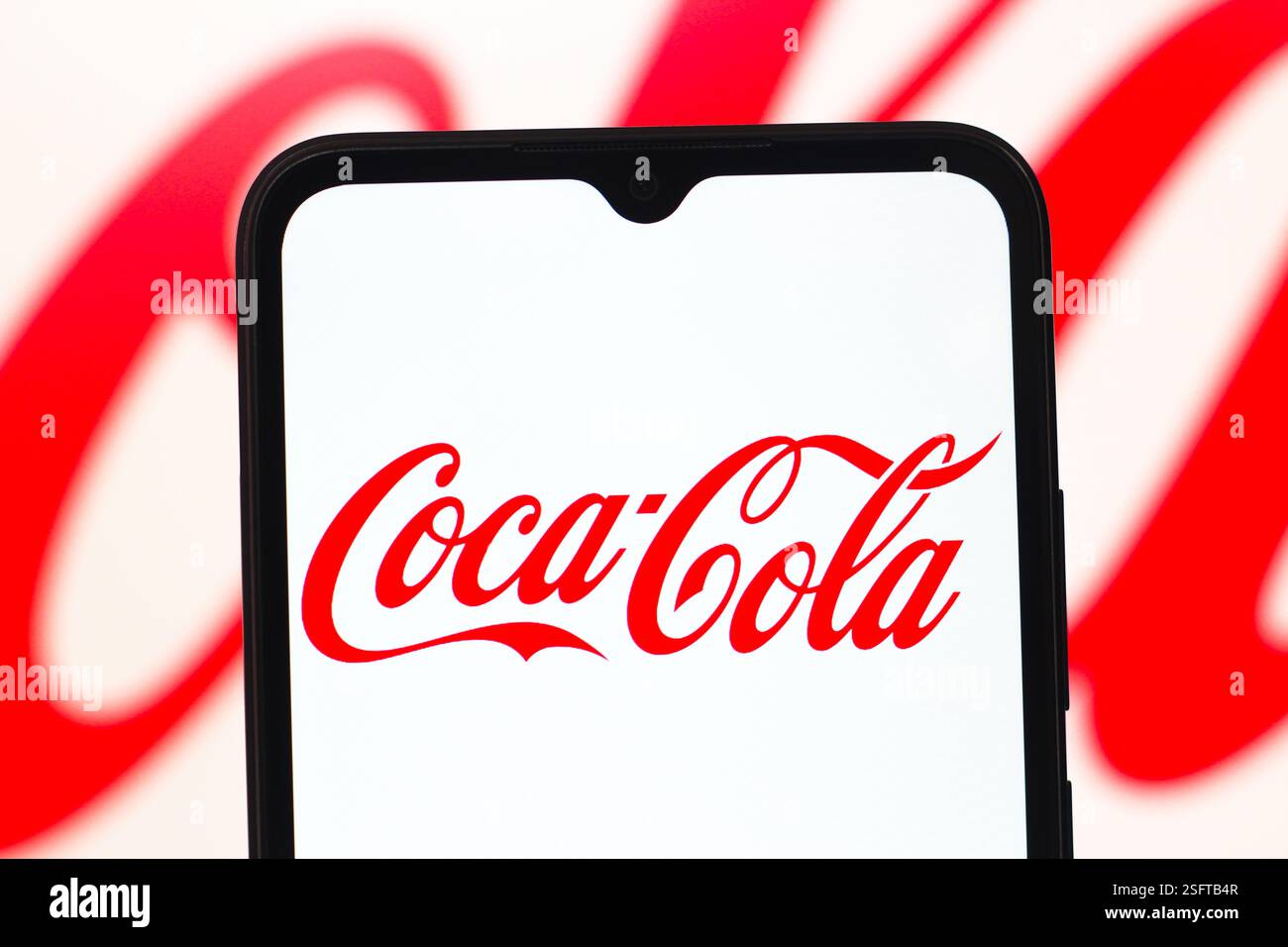 In this photo illustration, the Coca-Cola logo is seen displayed on a ...