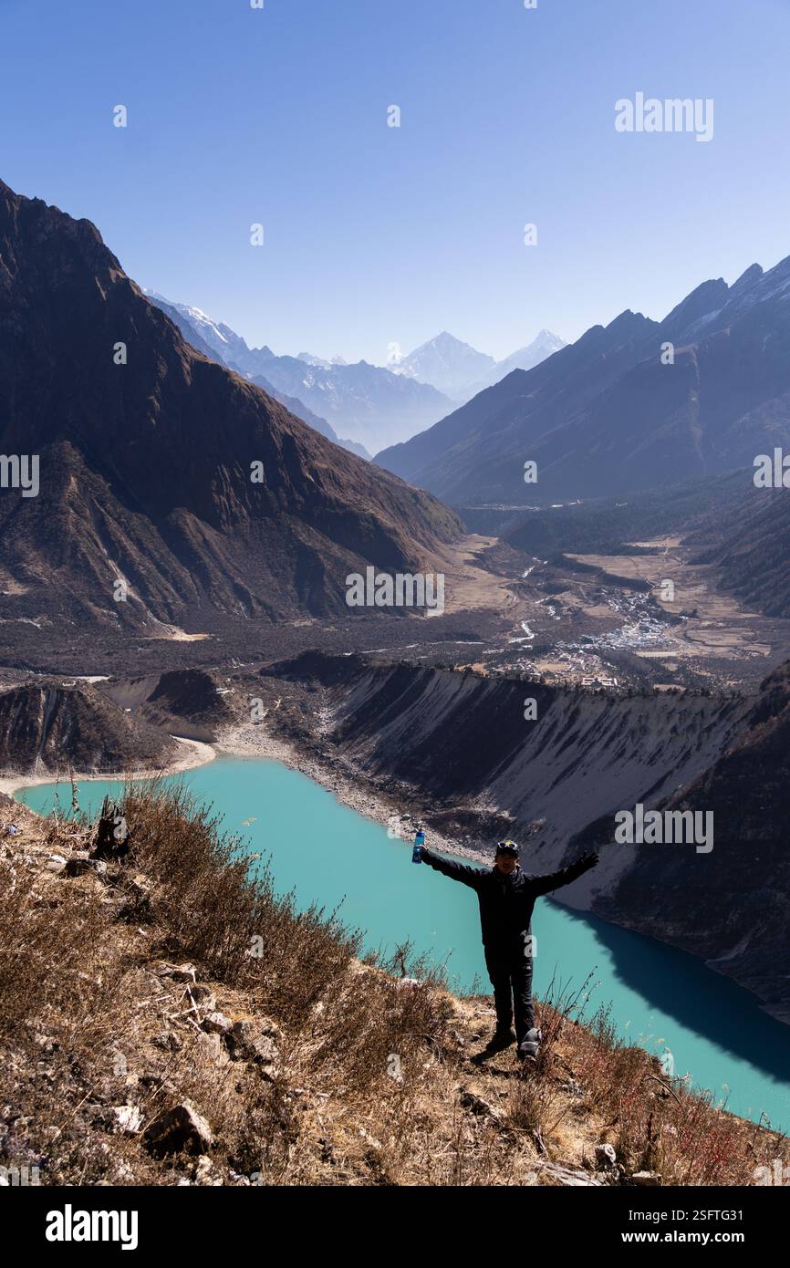 Manaslu, Nepal - November 24 2024: A Nepalese hiker enjoys the view ...