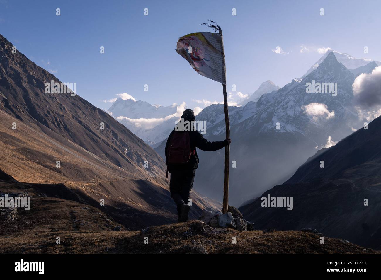 Manaslu Circuit, Nepal - November 26 2024: A local guide holds a ...