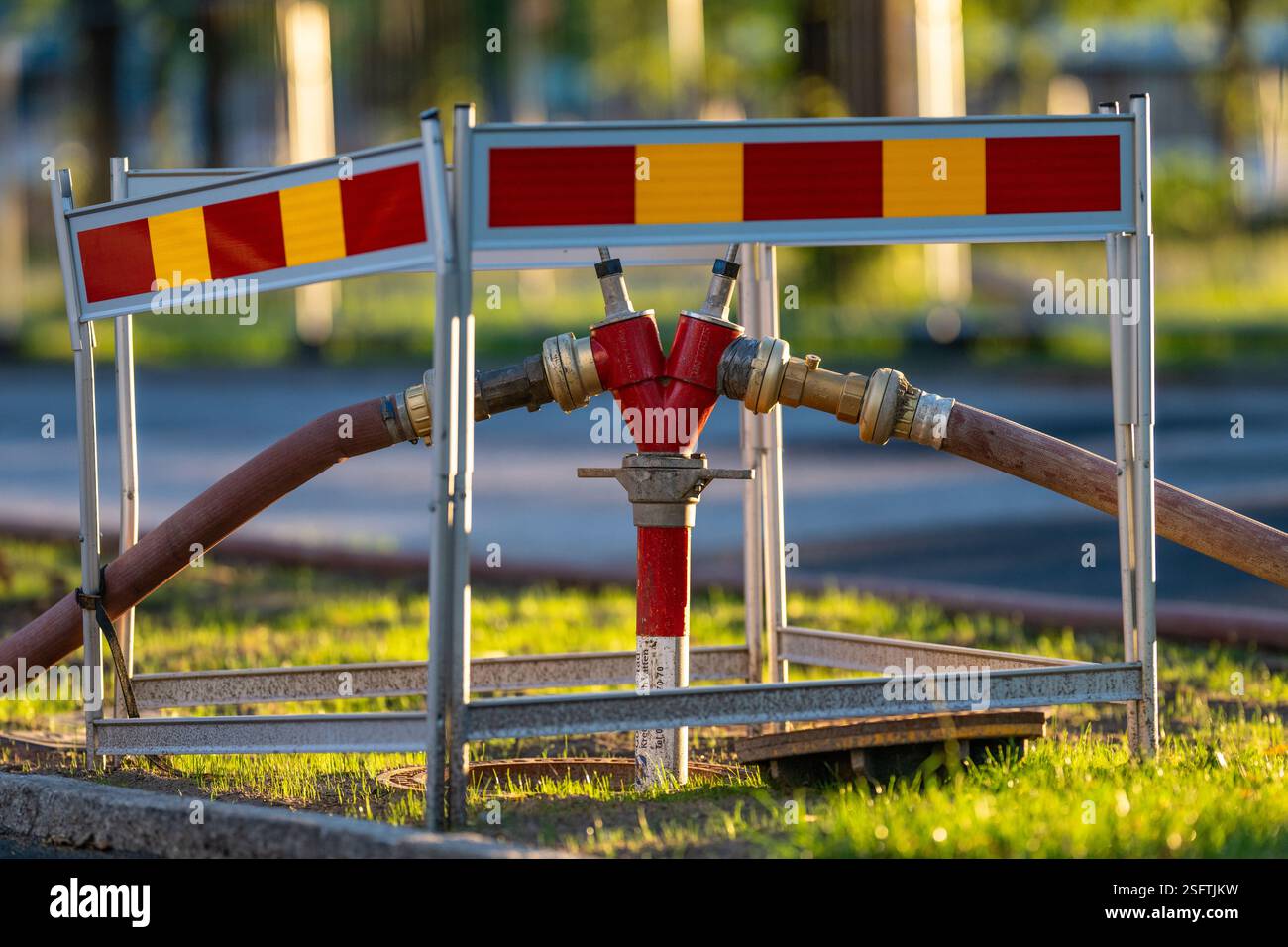 fire hydrant connection with hoses and barriers Stock Photo - Alamy