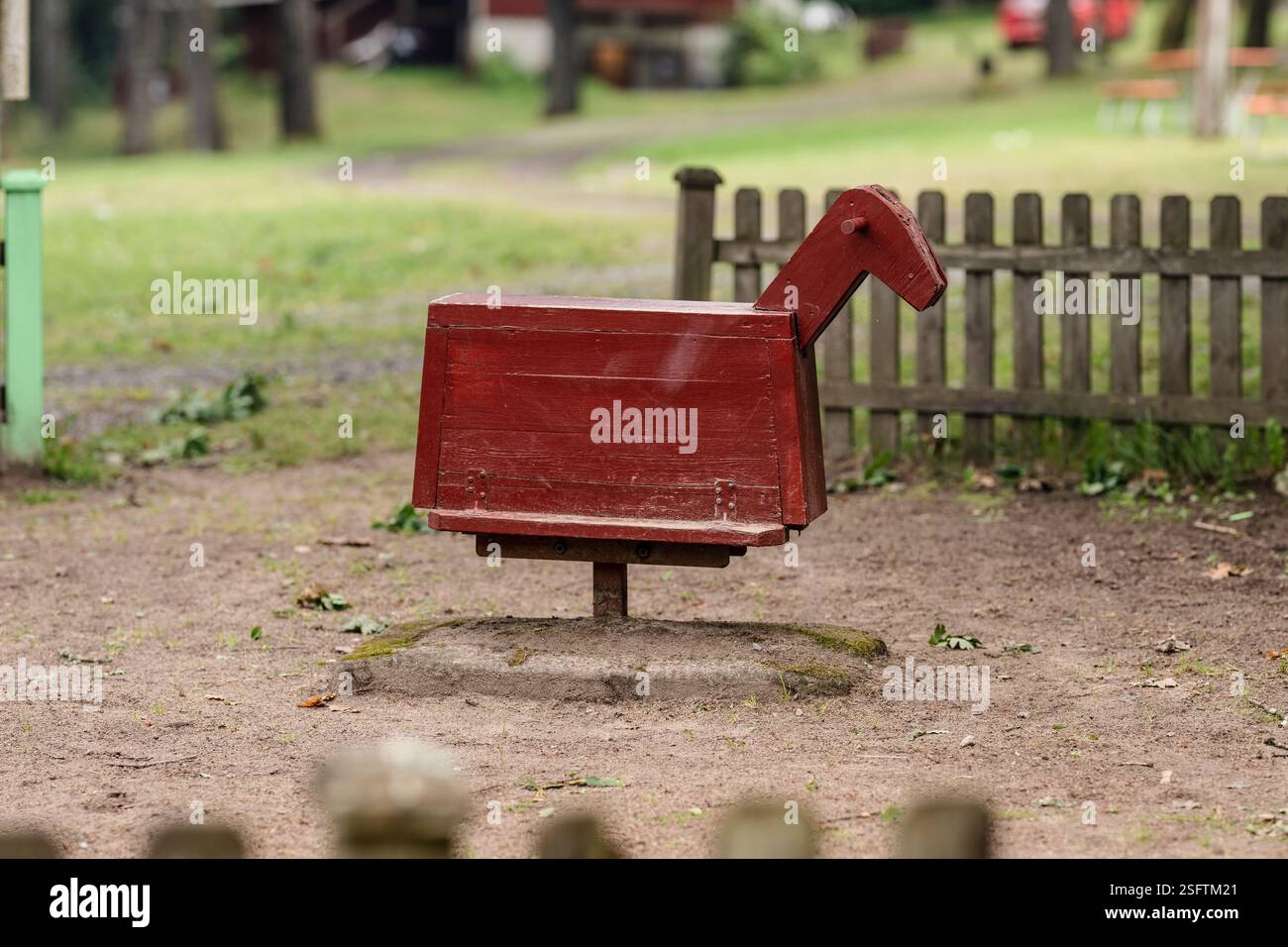 rustic wooden playground rocking horse in a park setting Stock Photo ...