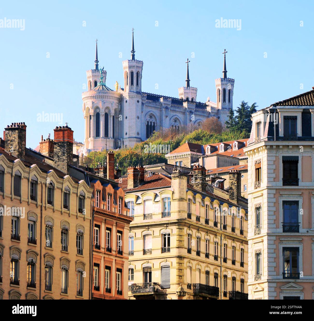 The Fourvière basilica, in Lyon, standing out against the roofs of ...