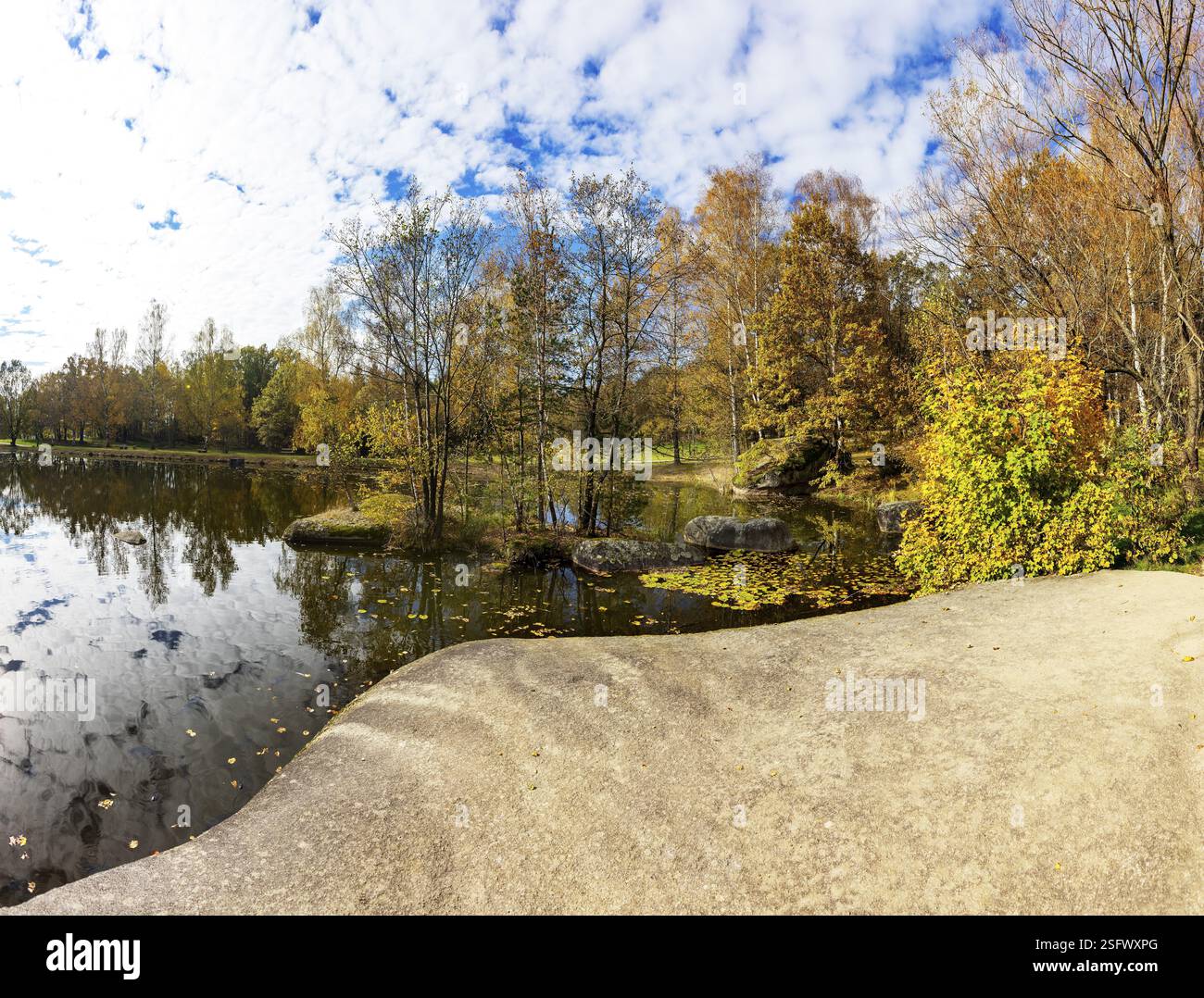 Fish pond with granite rocks in the Blockheide nature park Park near ...