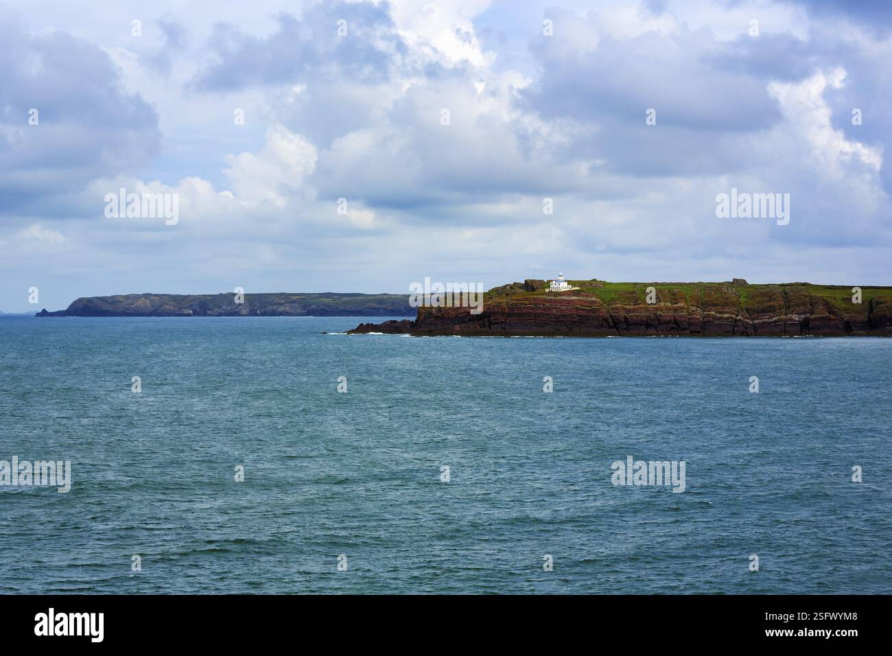 Lighthouse on the cliffs, St Ann's Head Lighthouse at the entrance to ...