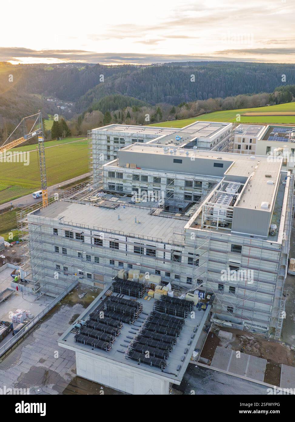 Building complex under construction with cranes and infrastructure ...