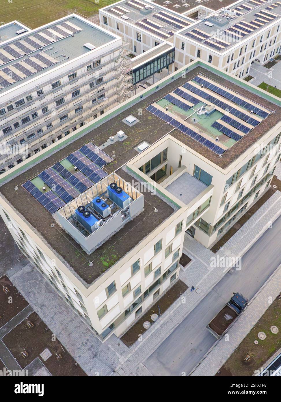 Building with solar cells on the roof, modern architectural style in an ...