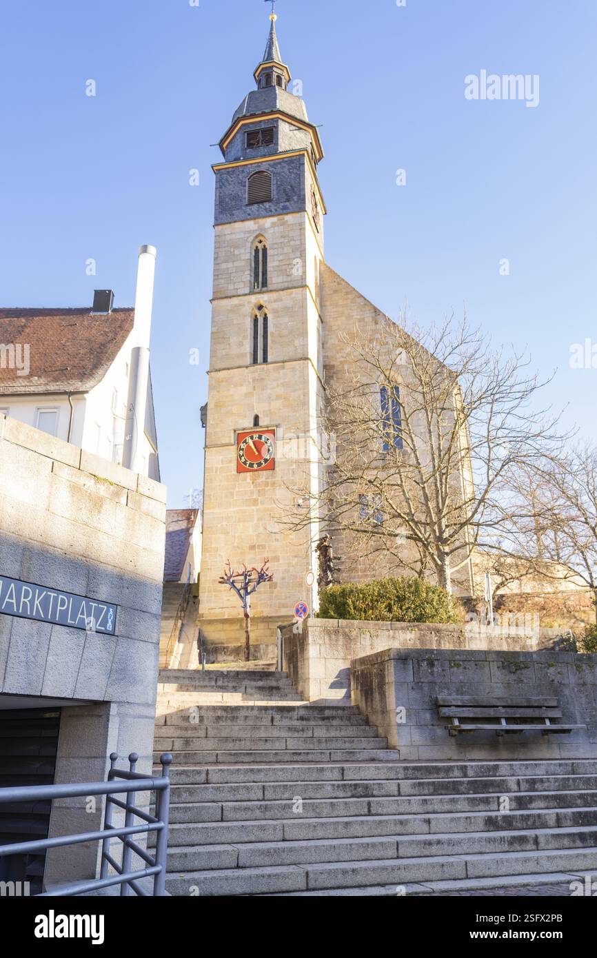 Stone steps leading to a church tower in the town centre on a clear day ...