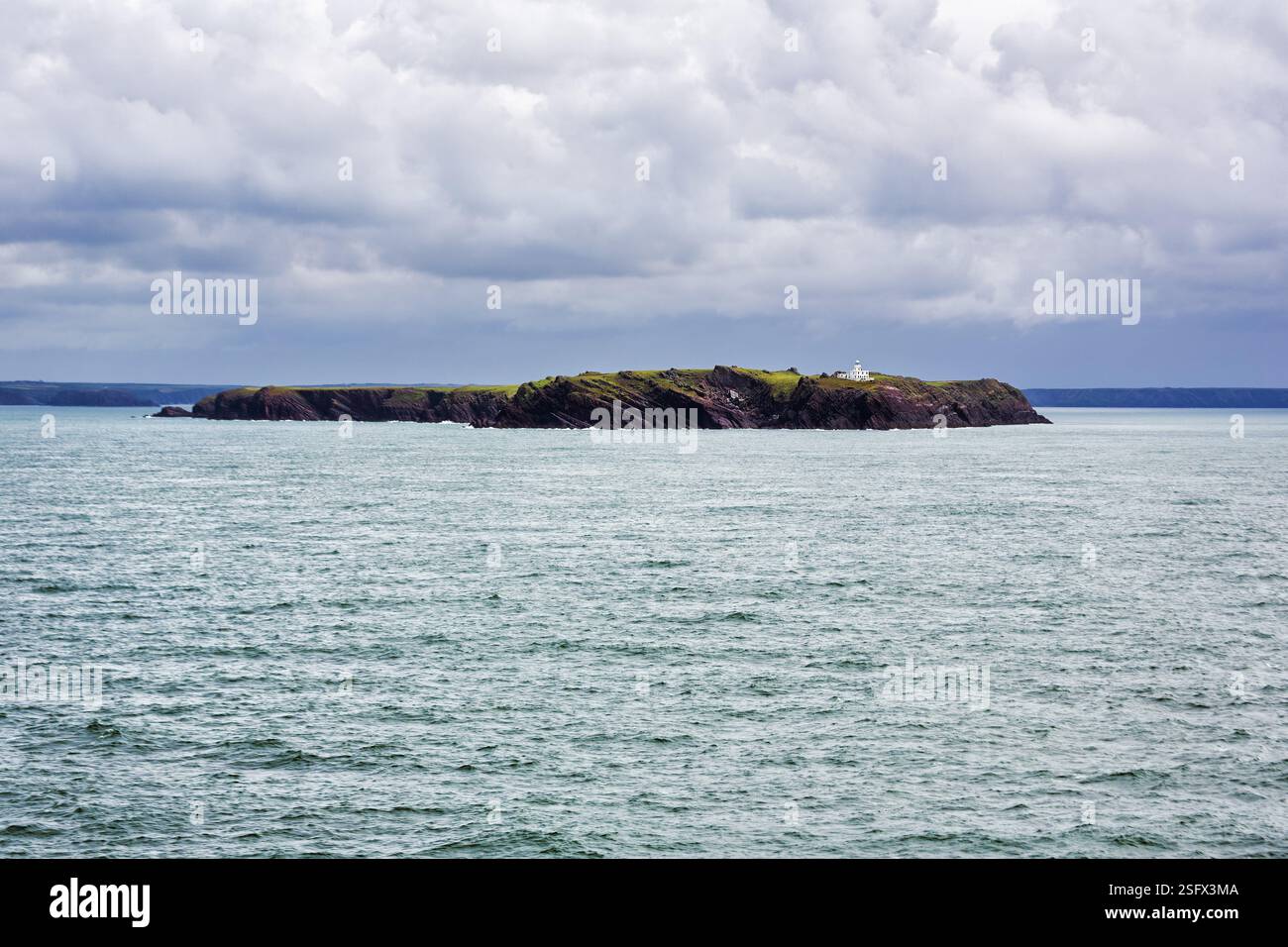 Lighthouse on the cliffs, St Ann's Head Lighthouse at the entrance to ...