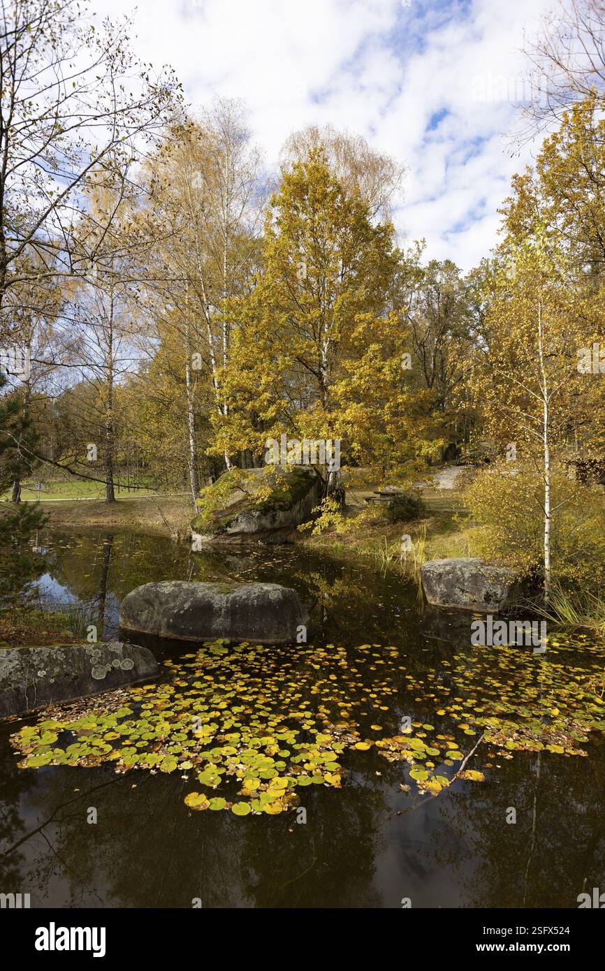 Fish pond with granite rocks in the Blockheide nature park Park near ...
